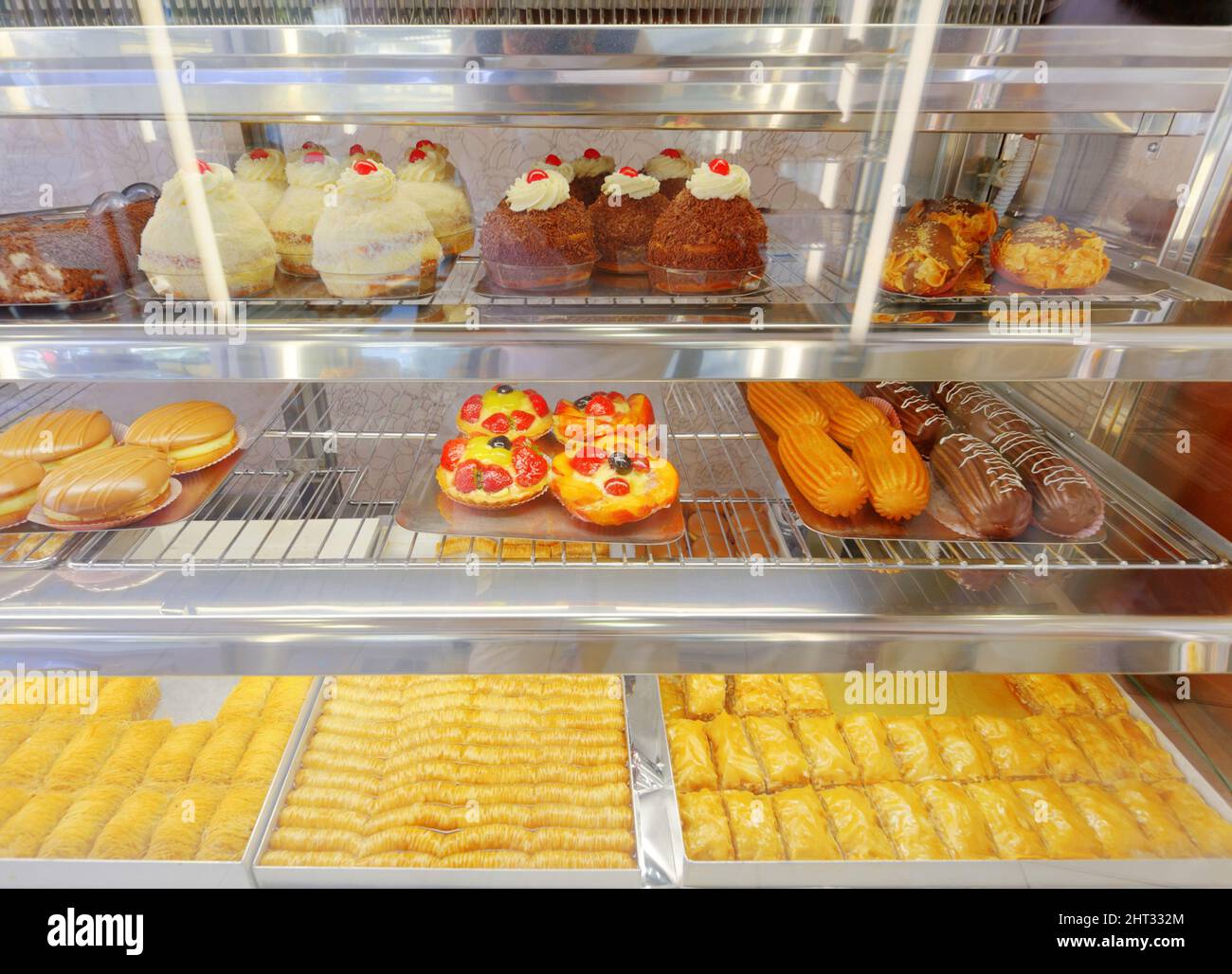 The pastry aisle. Shot of pastry behind window glass at a bakery Stock ...