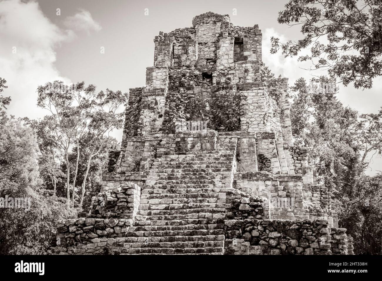 Old black and white picture of the ancient Mayan site with temple ruins ...
