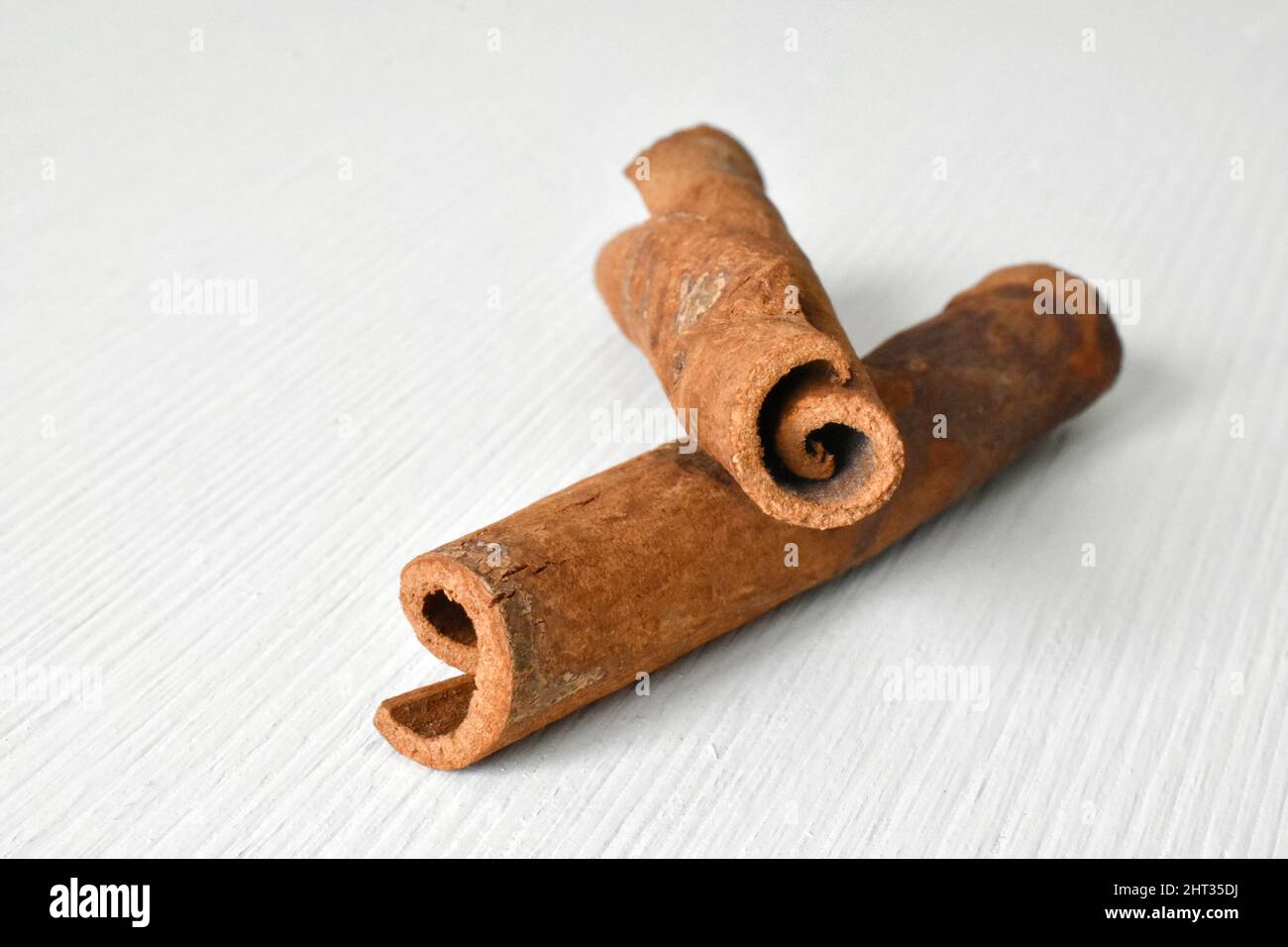 Dry cinnamon sticks, bark on a white background Stock Photo - Alamy