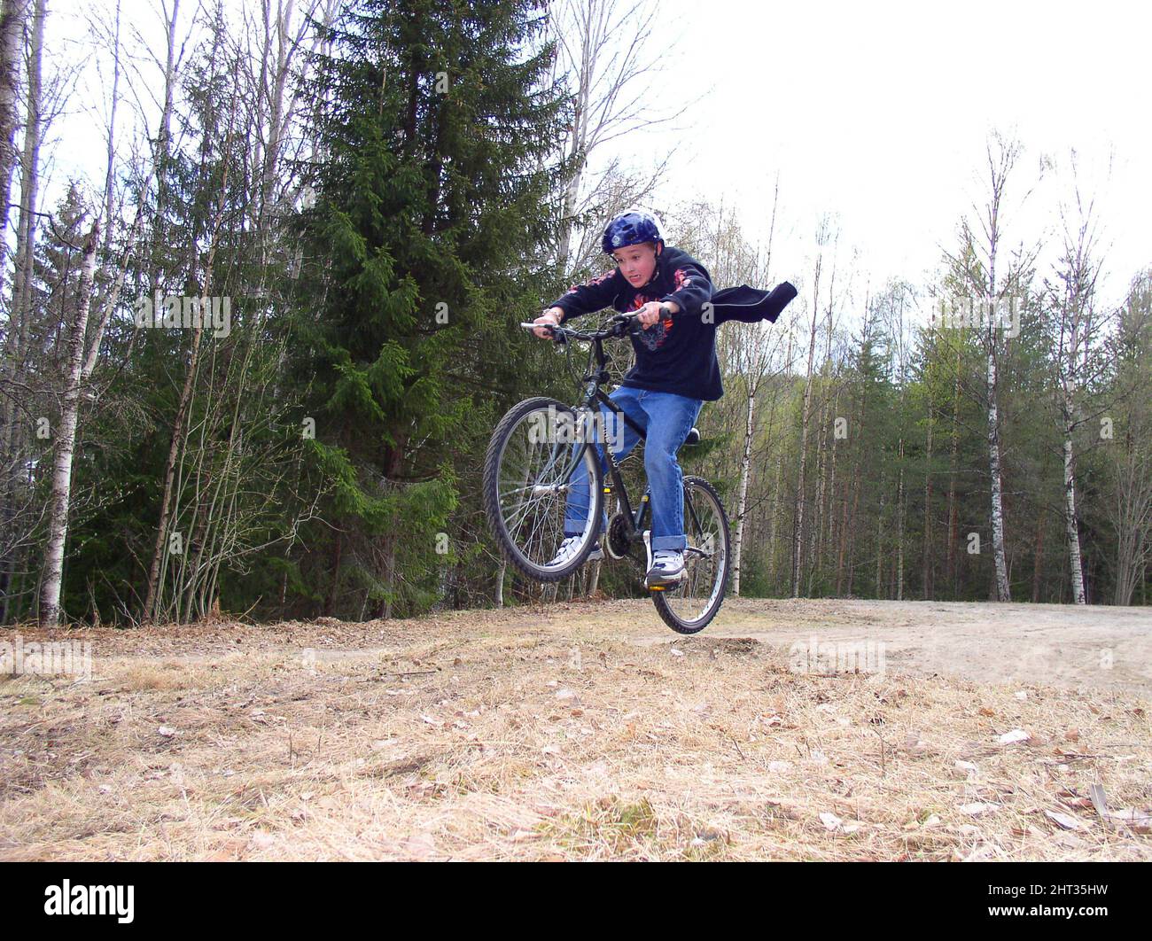 Boy riding a mountain bike Stock Photo - Alamy