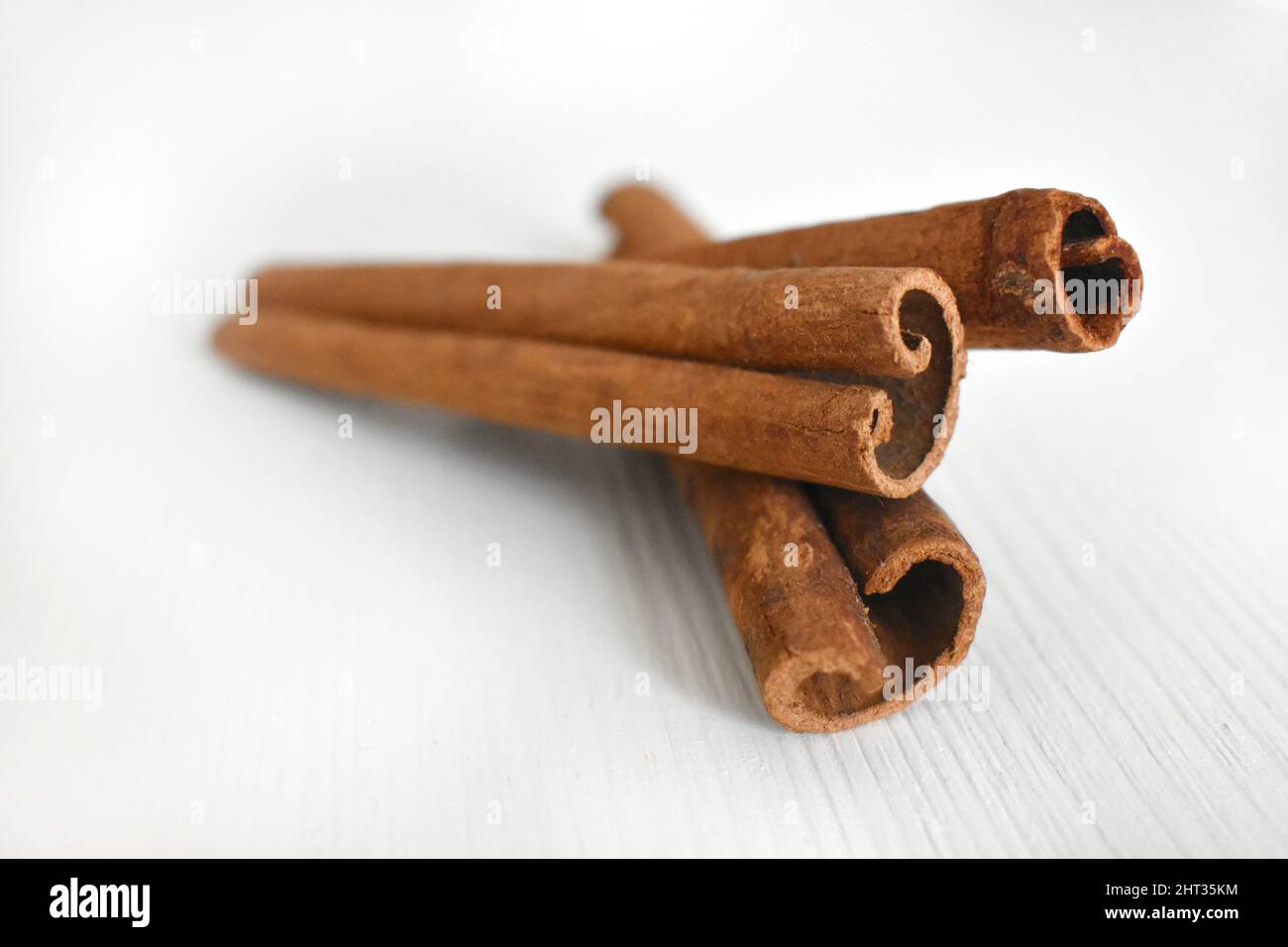 Dry cinnamon sticks, bark on a white background Stock Photo - Alamy