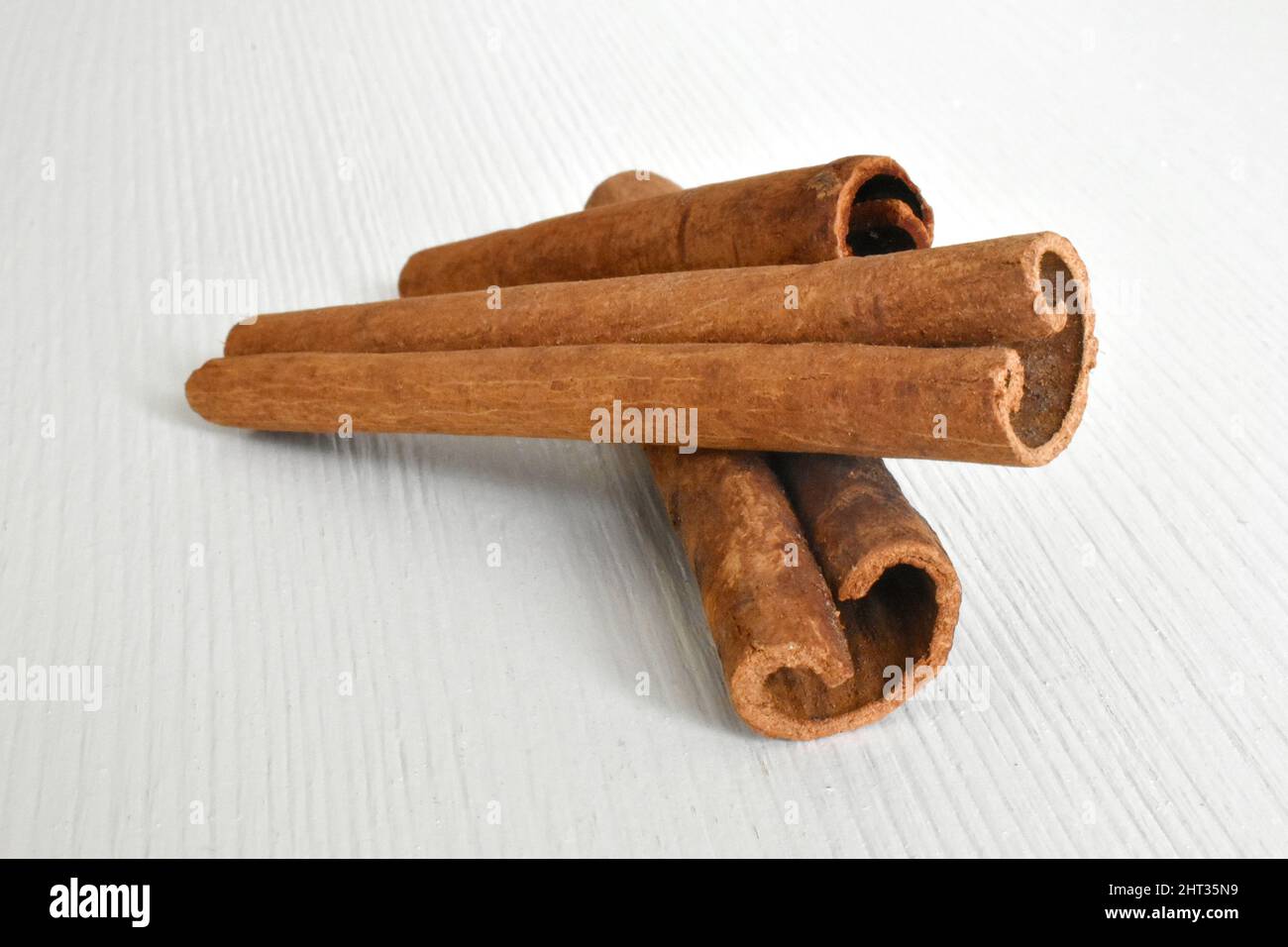 Dry cinnamon sticks, bark on a white background Stock Photo - Alamy