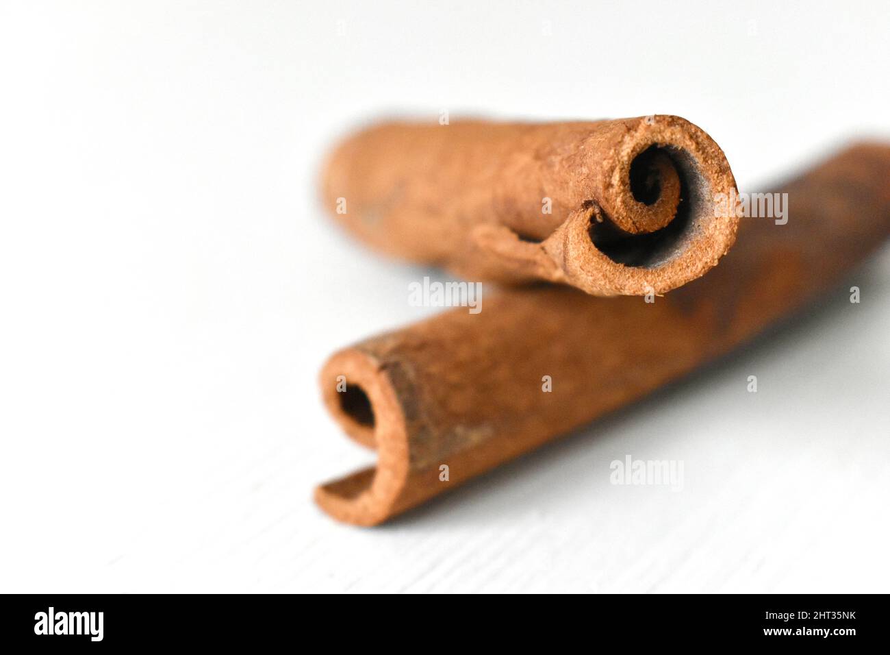 Dry cinnamon sticks, bark on a white background Stock Photo - Alamy
