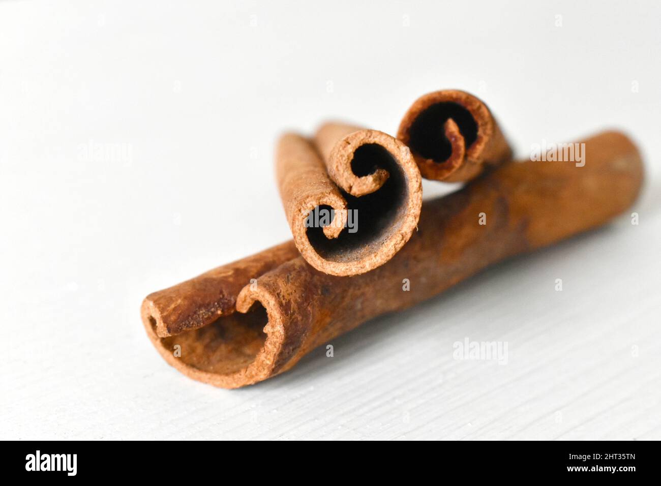 Dry cinnamon sticks, bark on a white background Stock Photo - Alamy