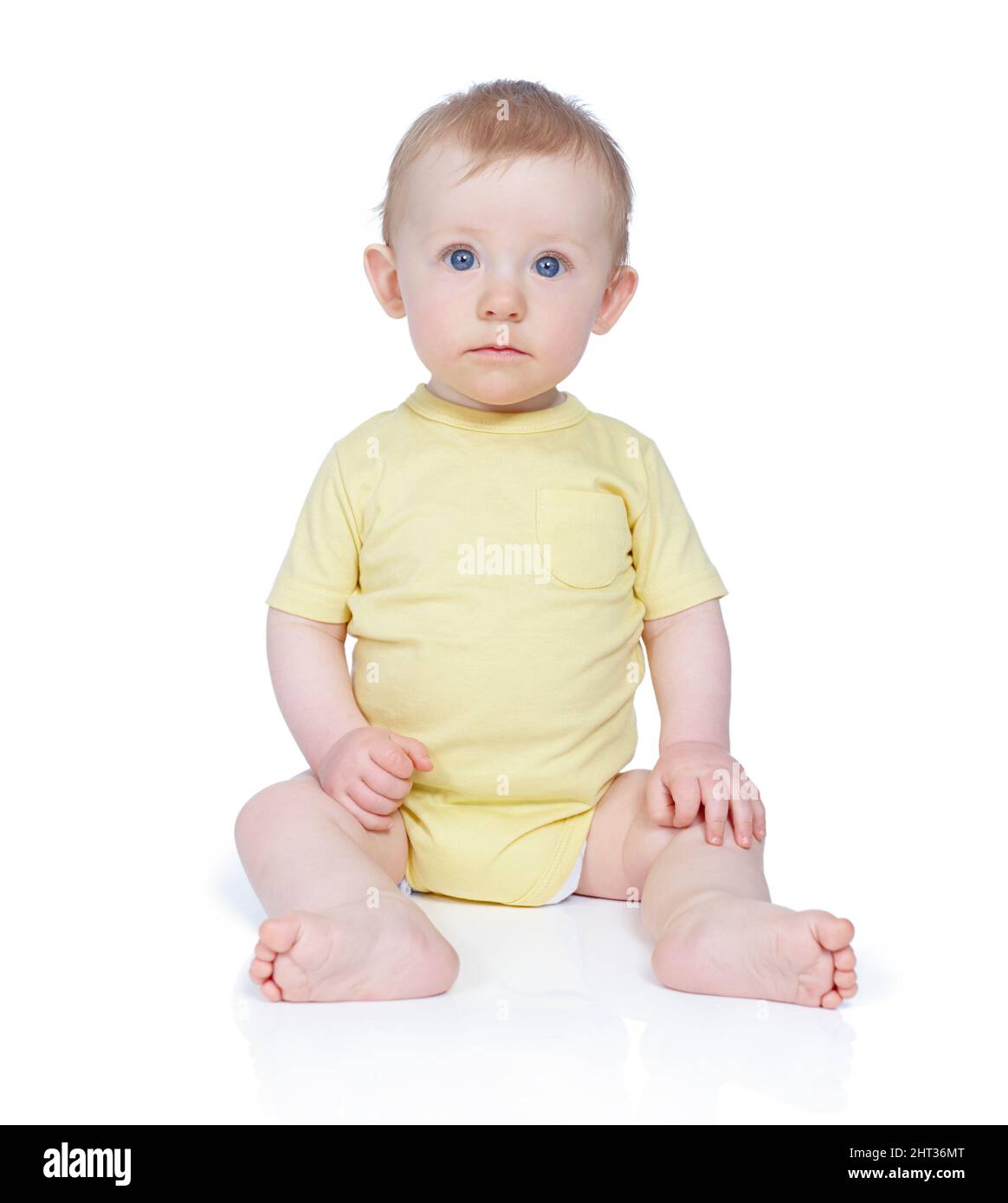 He finds you very interesting. A cute baby boy against a white ...