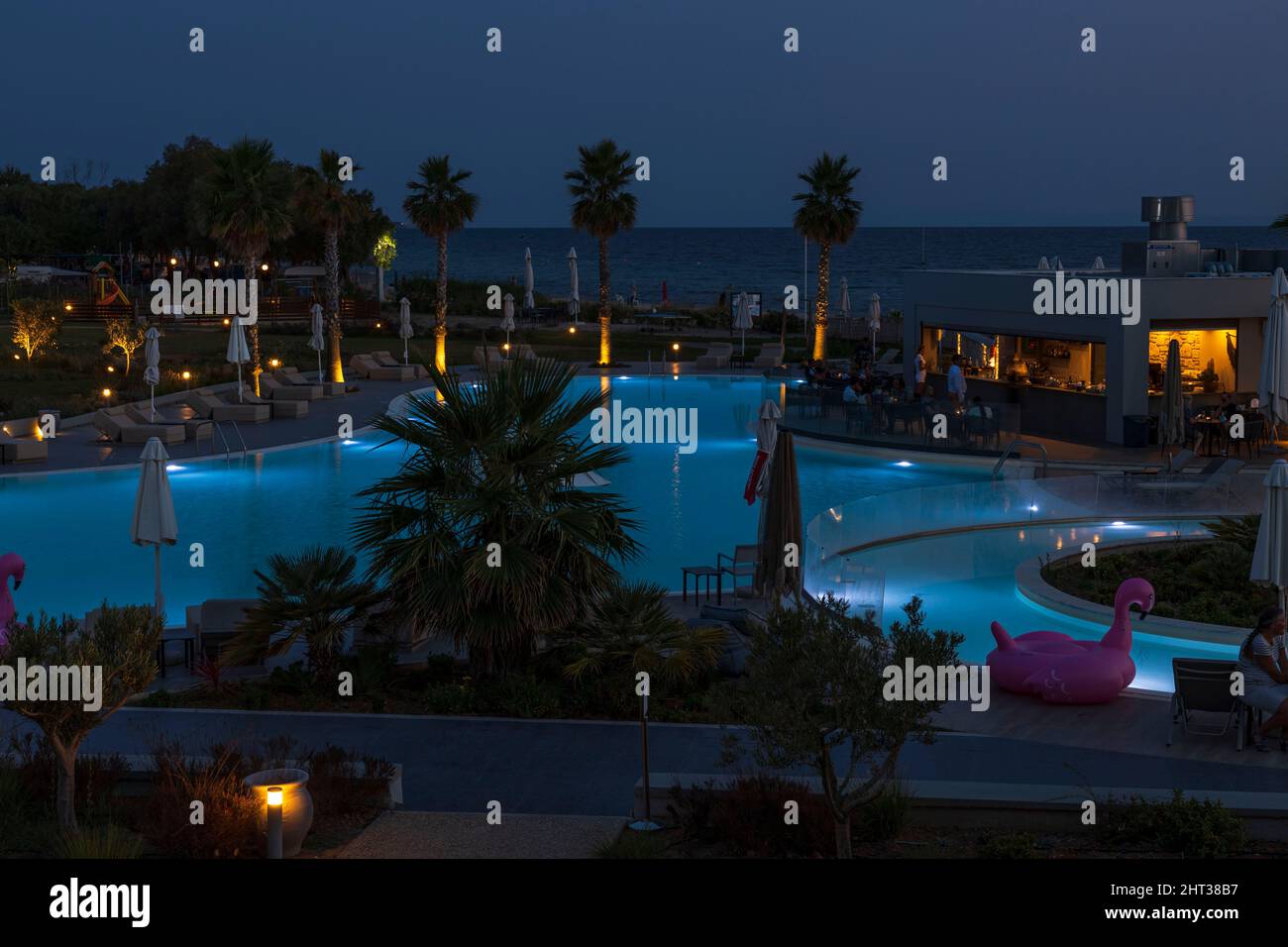 Beautiful night scenery overlooking hotel grounds. Lighting, trees ...