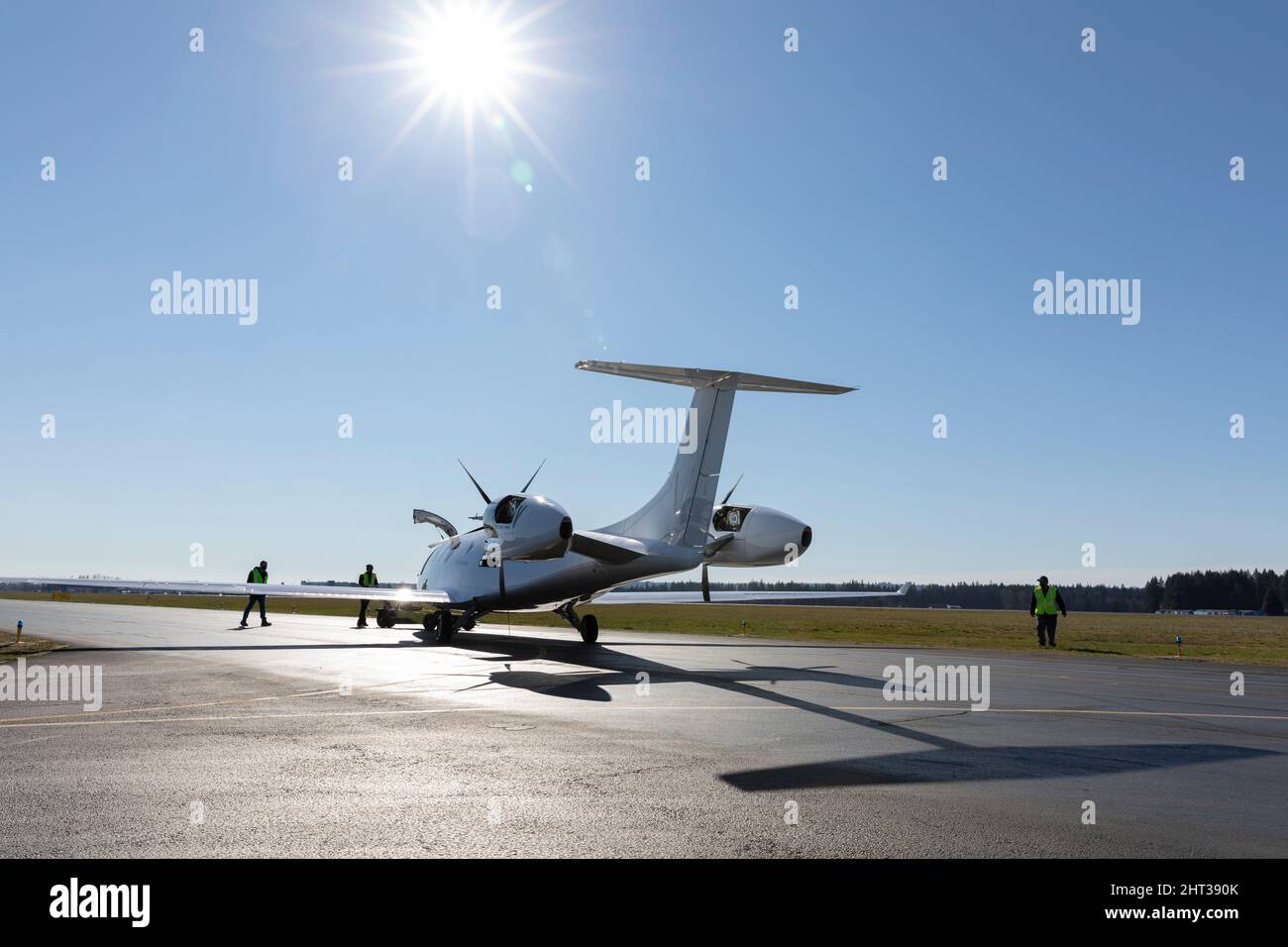 Members of the ground crew move the Alice V2 prototype all-electric ...