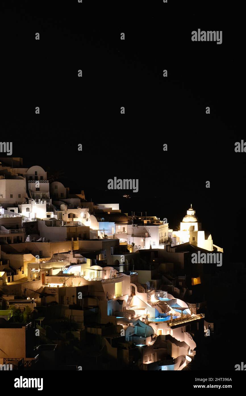 Panoramic view of the picturesque illuminated village of Fira Santorini ...