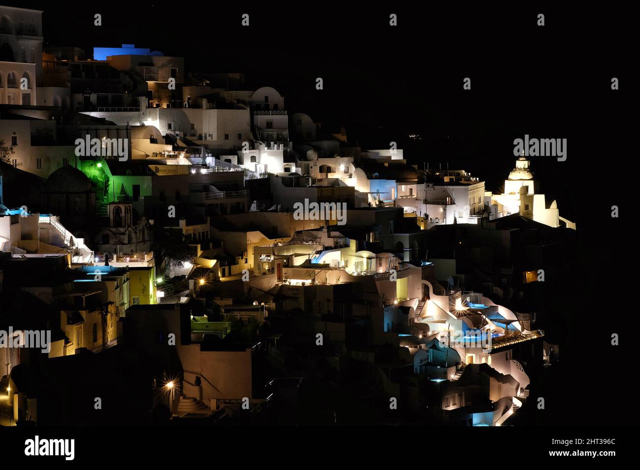 Panoramic view of the picturesque illuminated village of Fira Santorini ...