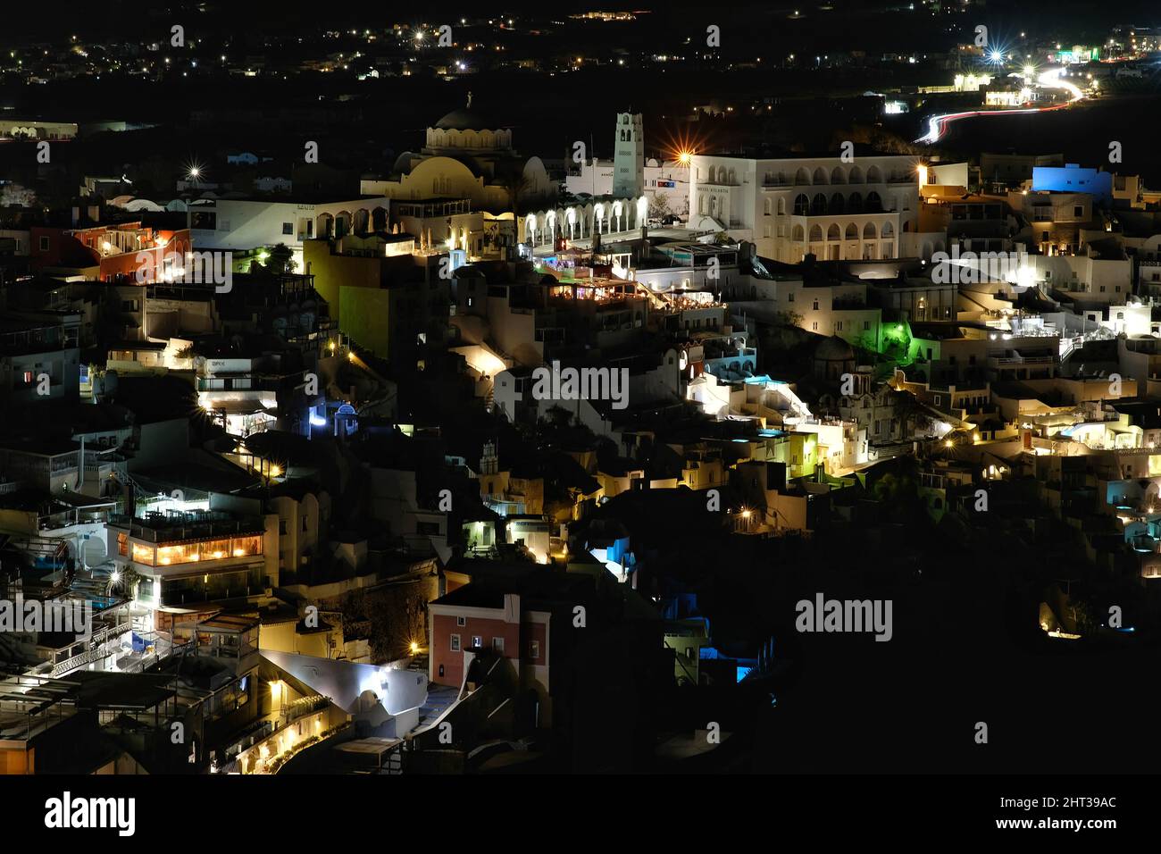 Panoramic view of the picturesque illuminated village of Fira Santorini ...