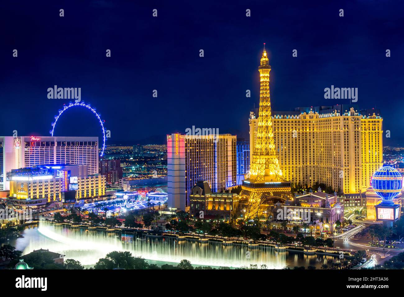 Night view of lighted Bellagio Fountains, Eiffel Tower in Las Vegas ...