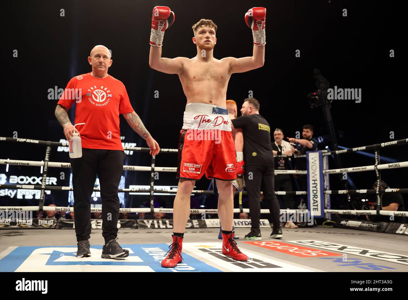 John Docherty (centre) celebrates victory against Jordan Grant during ...