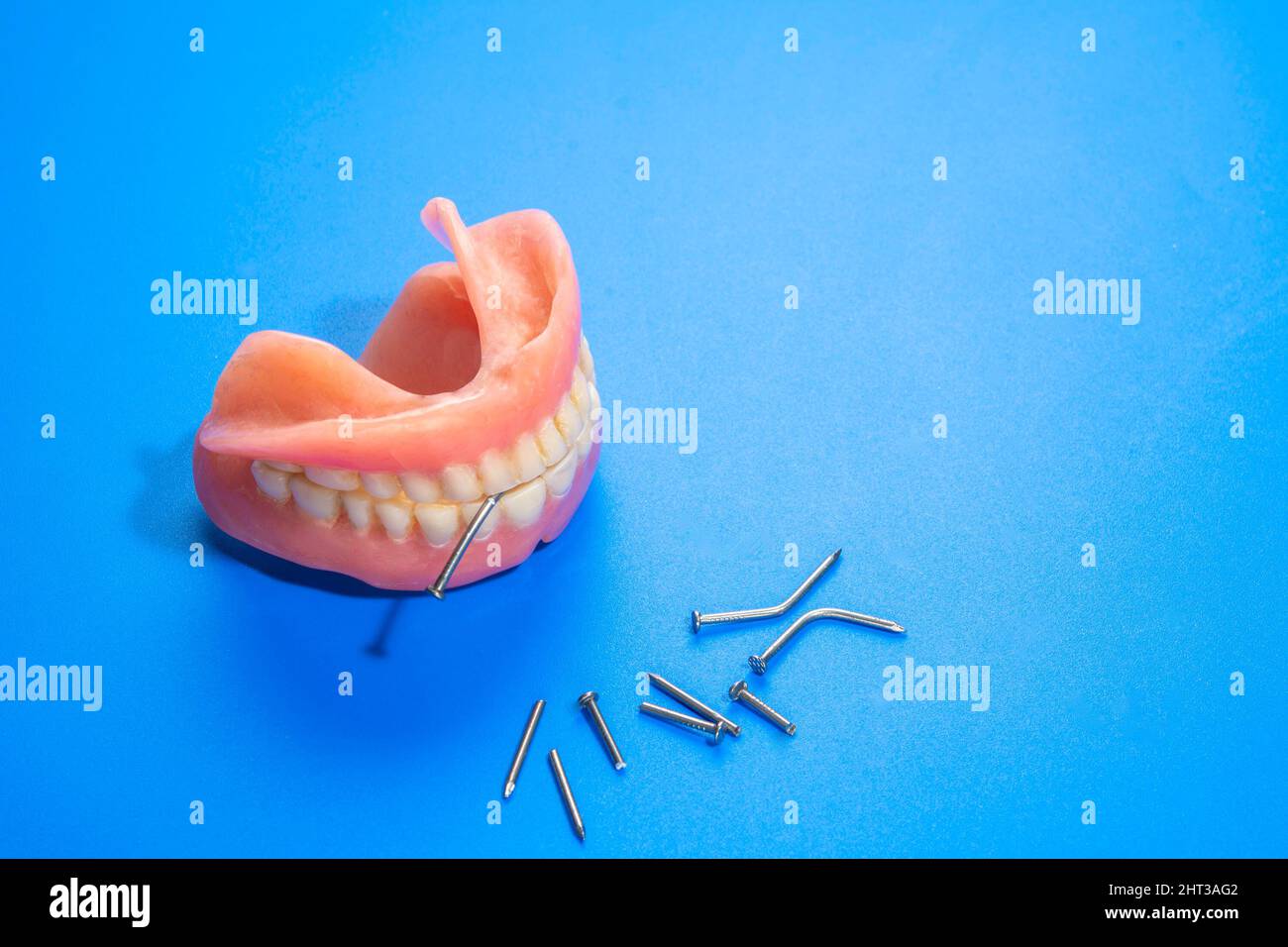 Denture bitten metal nailhand hi-res stock photography and images - Alamy