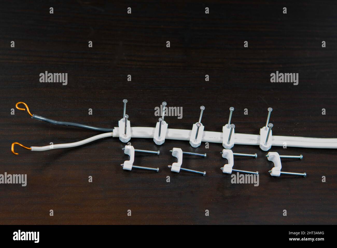 Clips with two nails for fastening, no damage, electrical wires Stock ...
