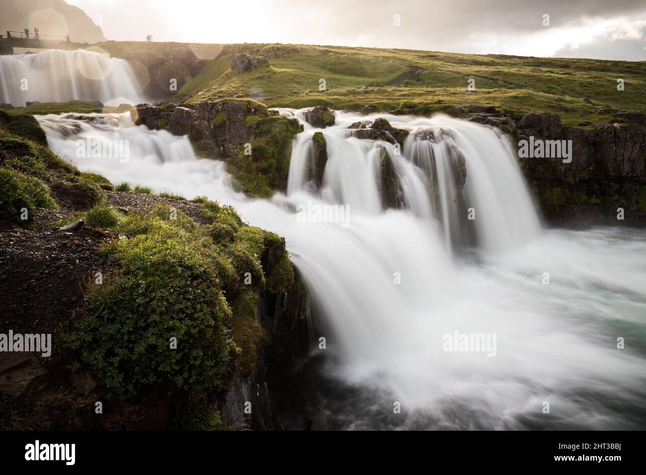 Mesmerizing bird's eye view of a fast-flowing waterfall on the cliffs ...