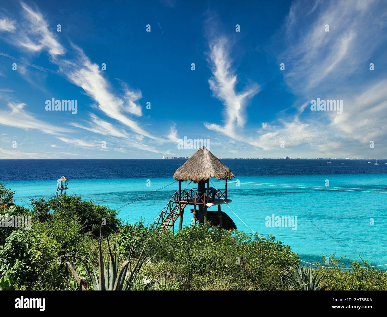 Beautiful shot of a wooden tower on an island in the background of a ...