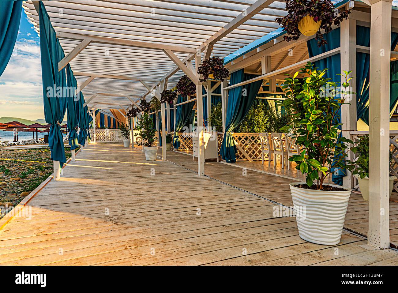 Summer terrace with places to relax on the beach Stock Photo - Alamy