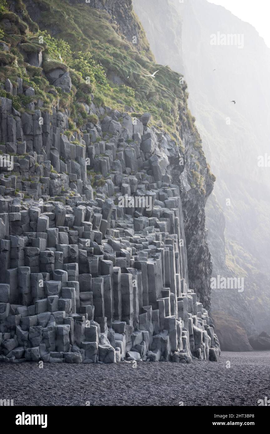 Vertical shot of the beautiful textured stones in different sizes on a ...