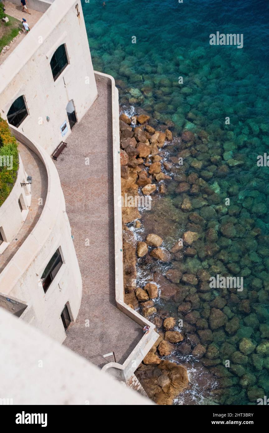 Vertical top view of white building by the rocky shore in Monaco Stock ...