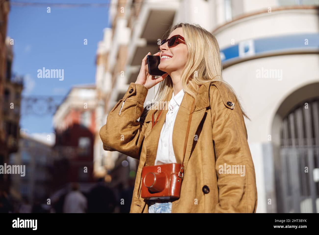 Positive lady standing outside smartphone hi-res stock photography and ...