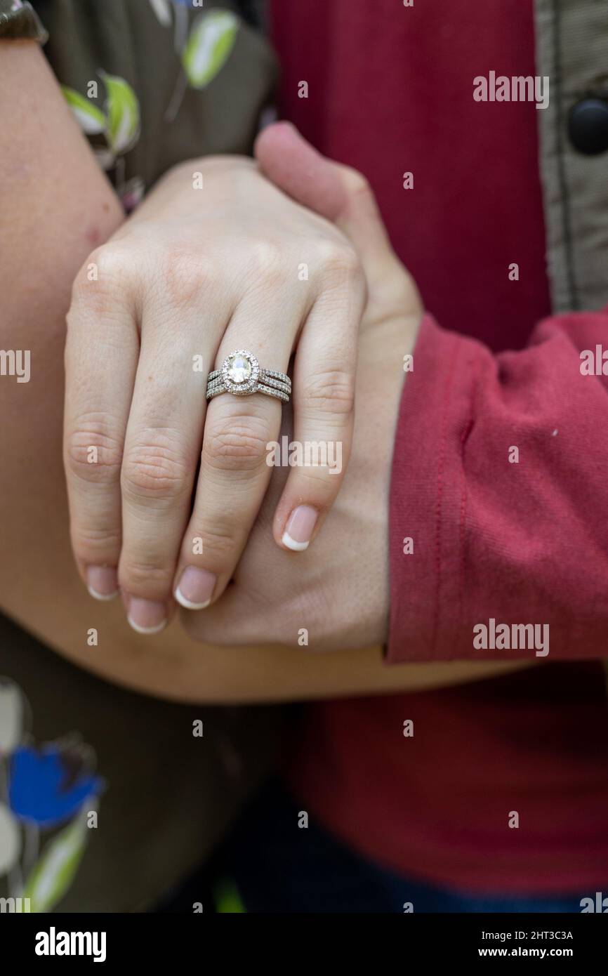 Vertical shot of a loving couple embracing, a female wearing an ...