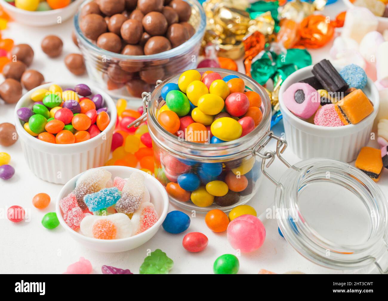Milk chocolate candies in shell with jelly sugar gums and liquorice ...