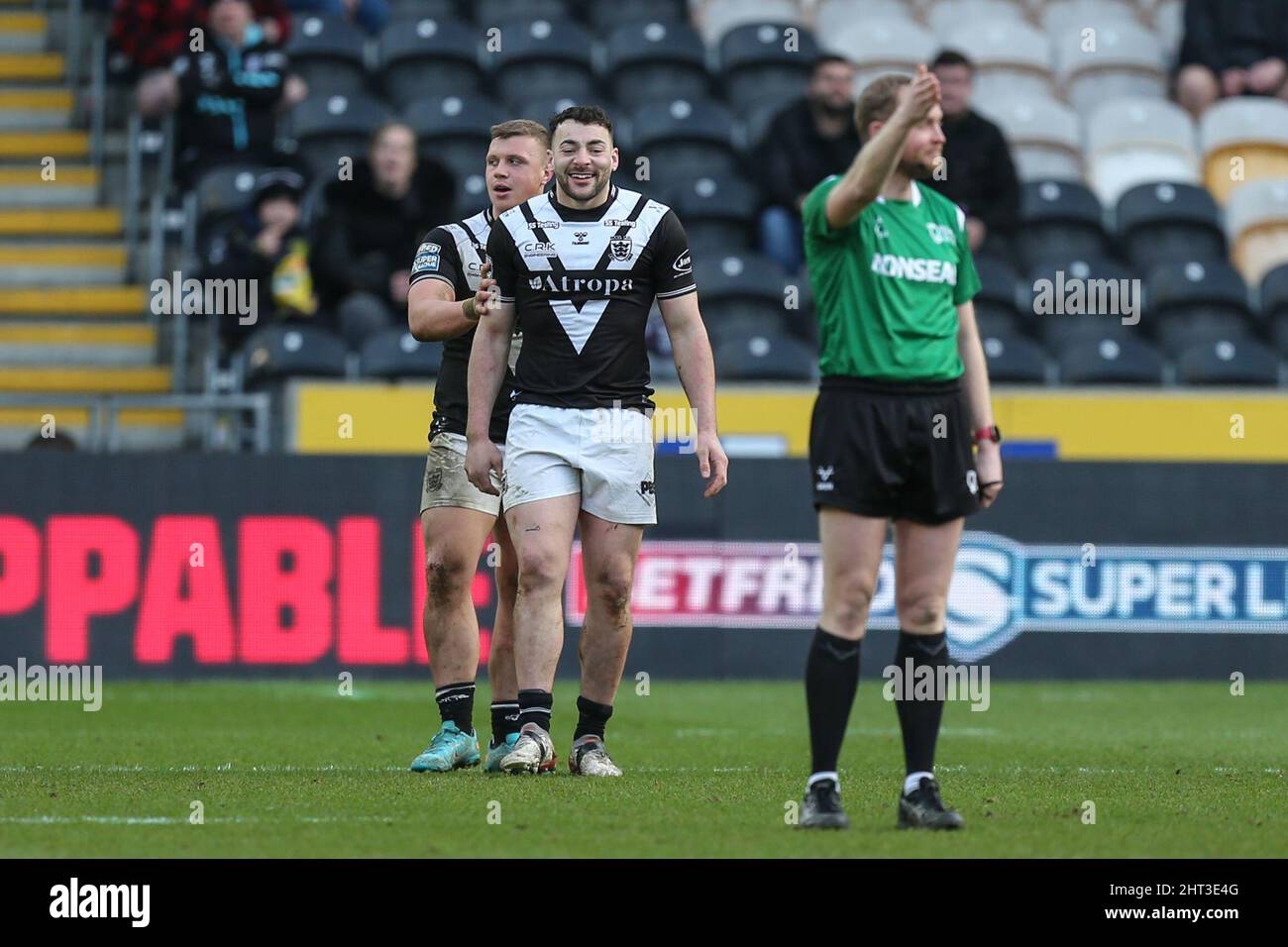 Jake Connor #1 of Hull FC sees the funny side of referee Robert Hicks ...