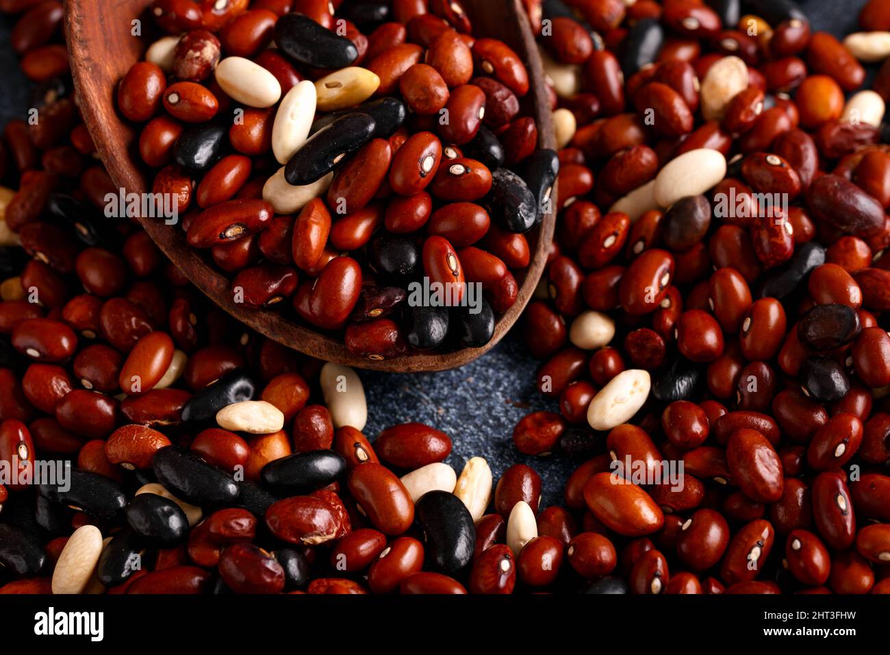 Dried red beans and black, white mix on rustic table Stock Photo - Alamy