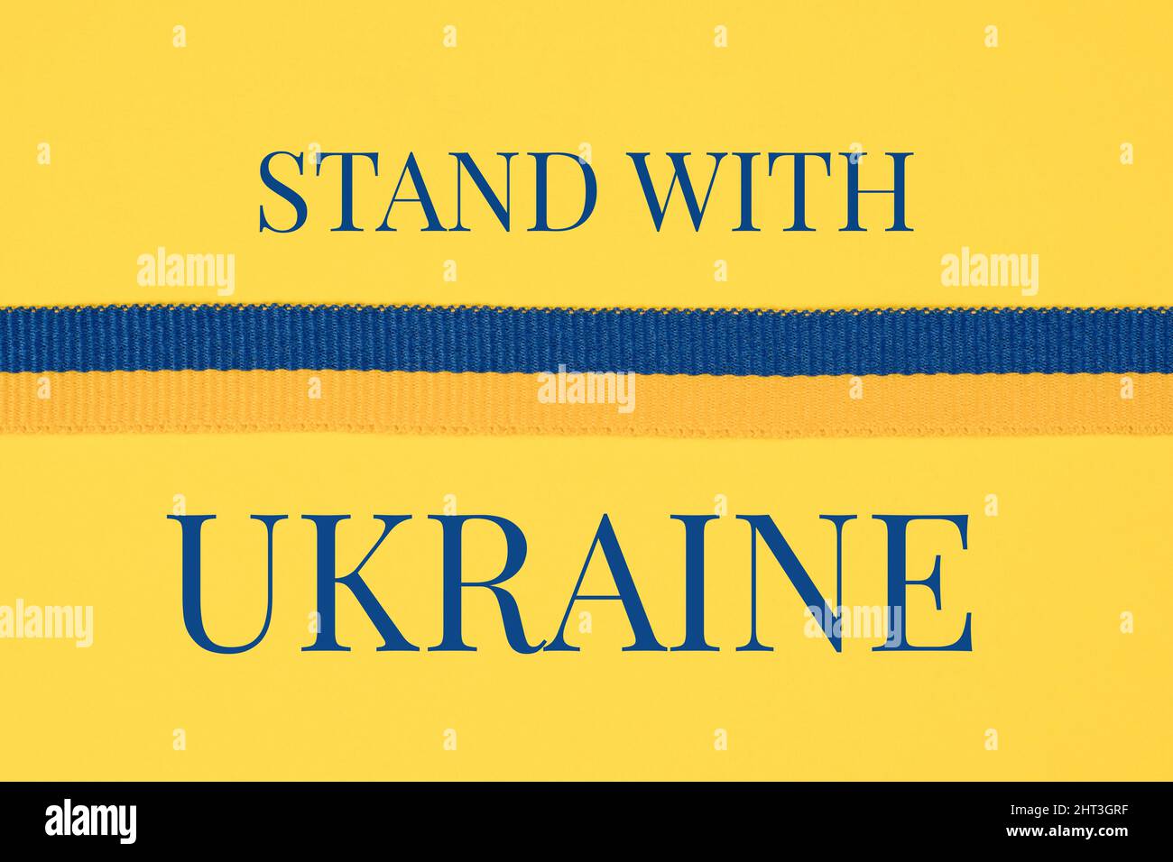 Stand with Ukraine - quote on yellow background with Ukrainian blue and ...