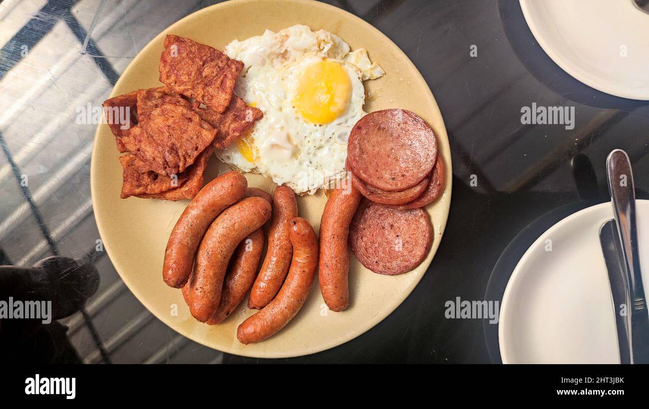 Top view of tasty breakfast with chicken sausage platter and omelette ...
