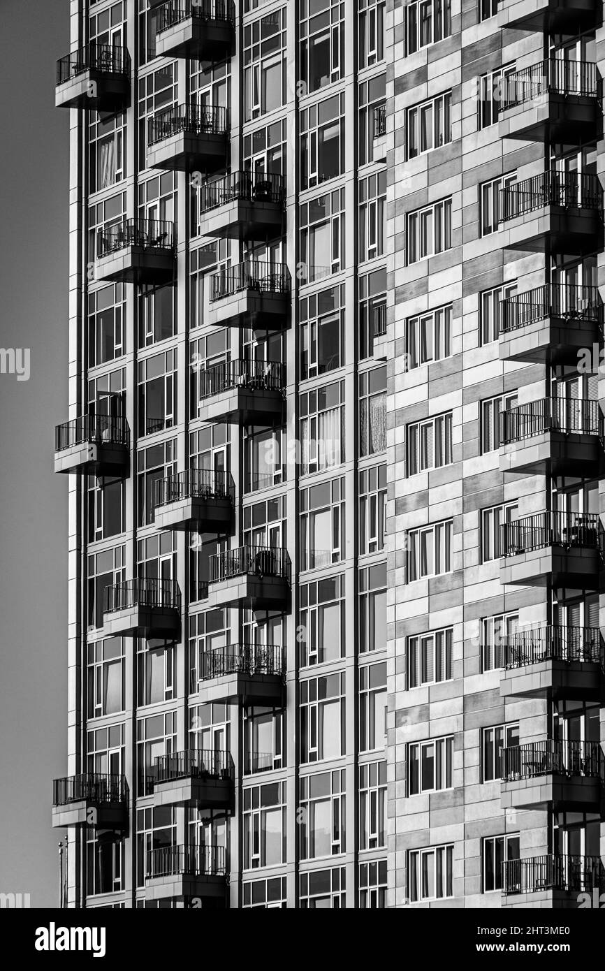 Grayscale shot of a modern glass window building Stock Photo - Alamy