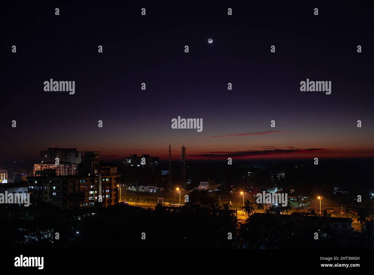 Beautiful dark night sky over an illuminated city Stock Photo - Alamy