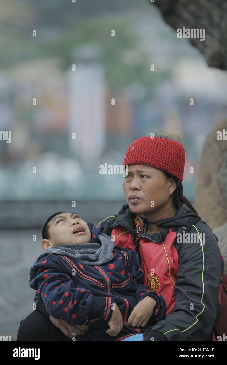 Photo of two homeless people in winter in Hanoi, Vietnam, Tran Quoc ...