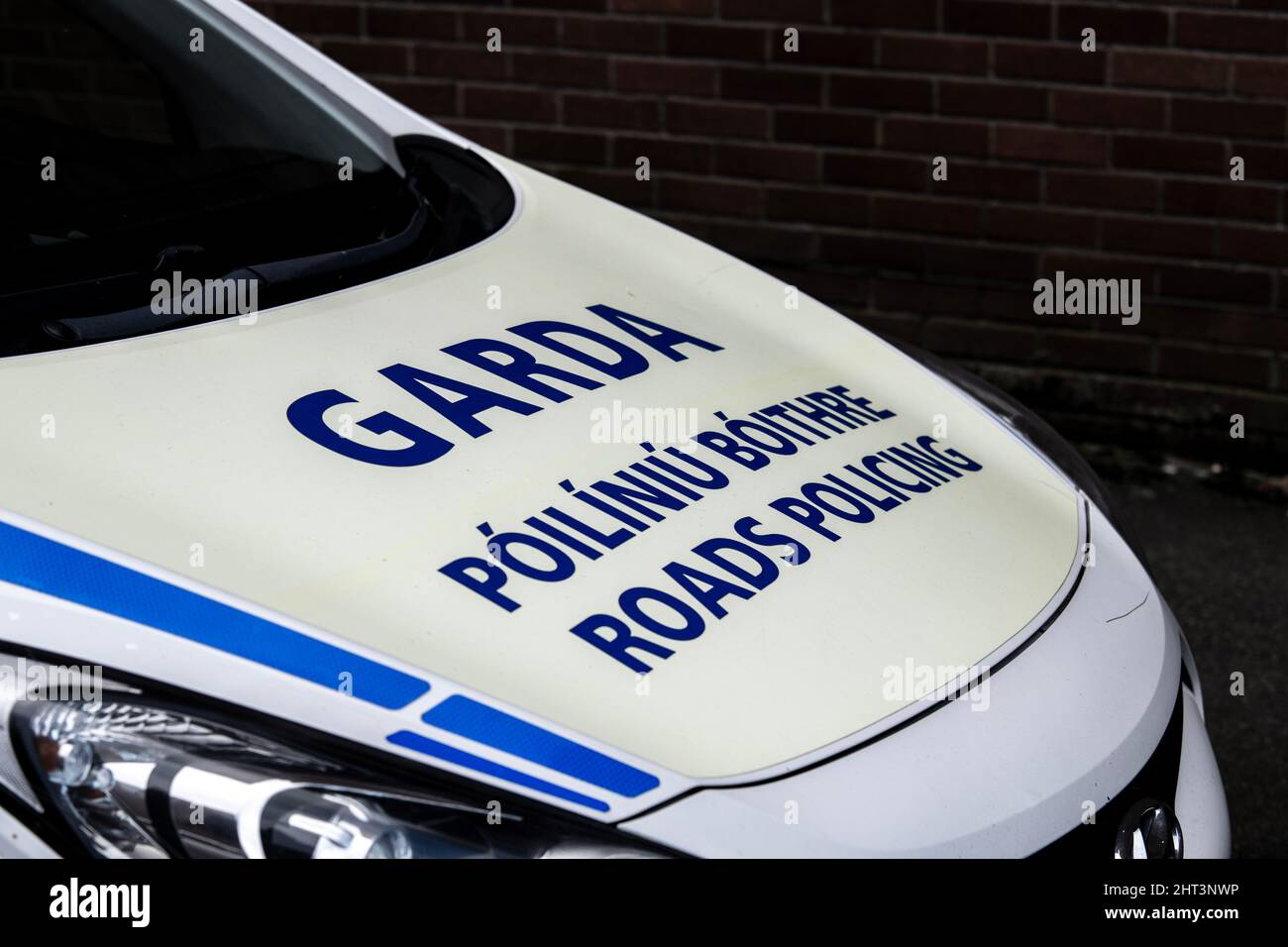 View of police emblems in Ireland, emblem on building, car, and street ...