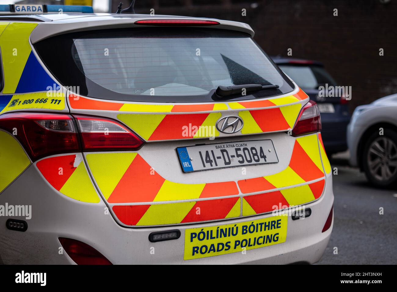 View of police emblems in Ireland, emblem on building, car, and street ...