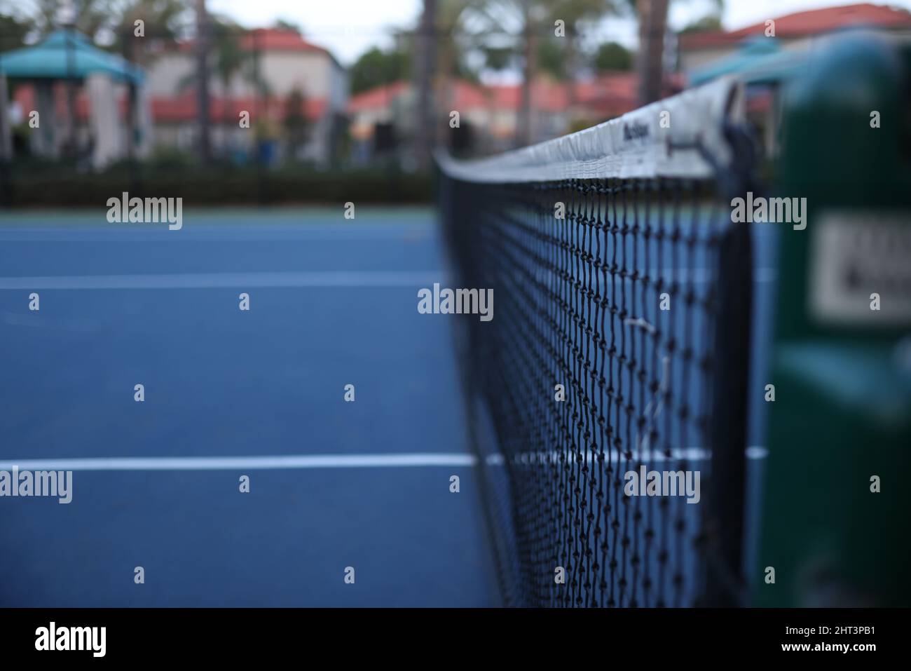 Close-up shot of a metallic barrier on a tennis field Stock Photo - Alamy