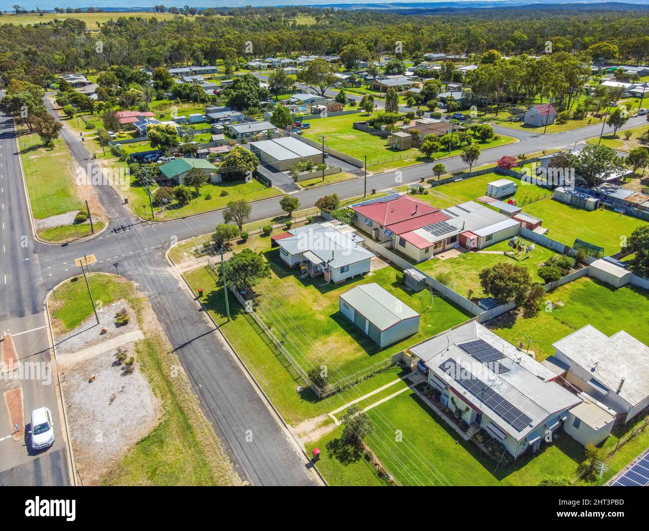 Aerial View of the town of Gilgai surrounded by green rainforests in ...