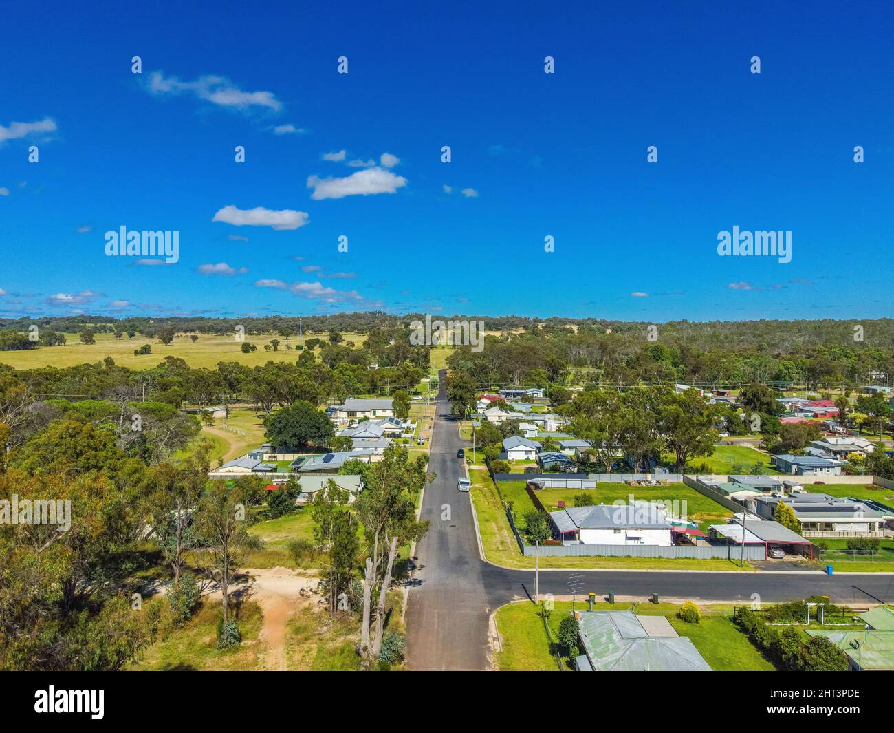 Aerial View of the town of Gilgai surrounded by green rainforests in ...