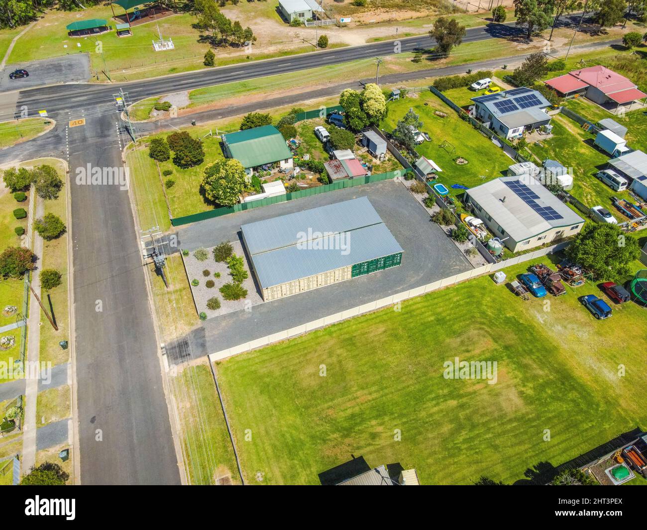 Aerial View of the town of Gilgai surrounded by green rainforests in ...
