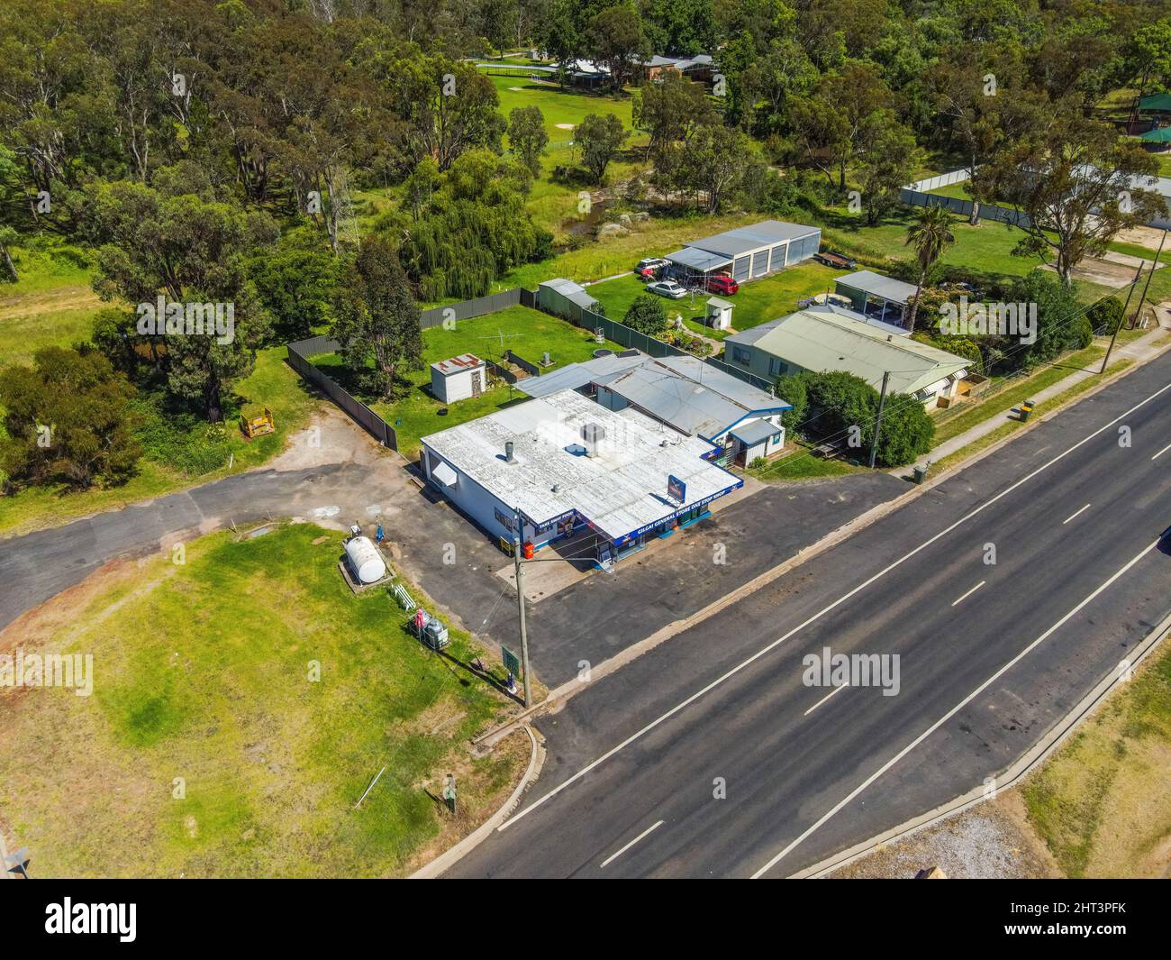 Aerial View of the town of Gilgai surrounded by green rainforests in ...