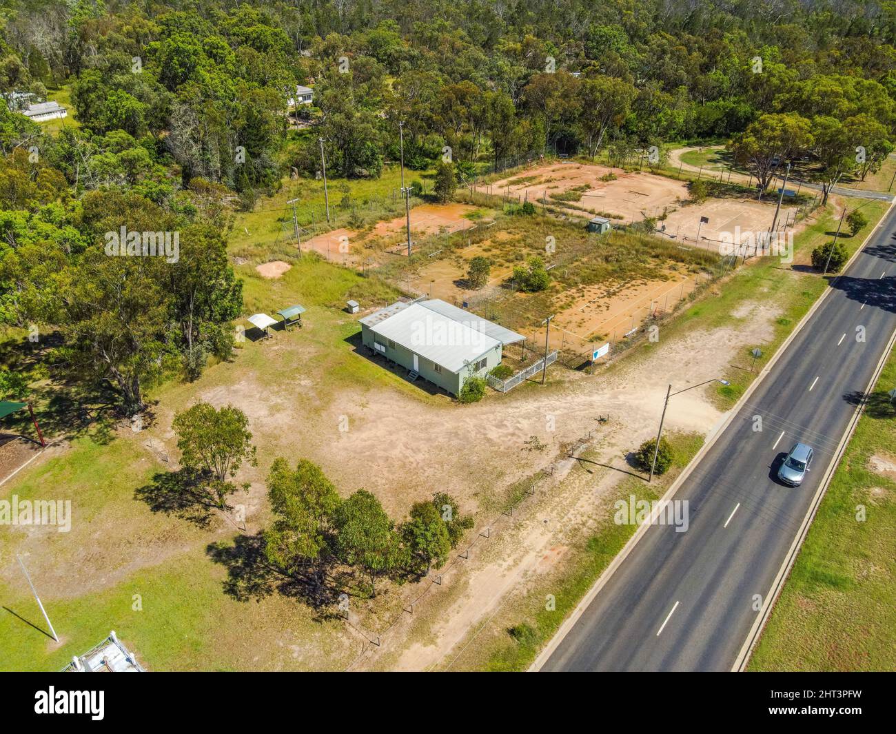Aerial View of the town of Gilgai surrounded by green rainforests in ...