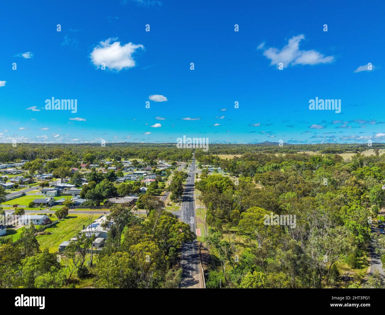 Aerial View of the town of Gilgai surrounded by green rainforests in ...