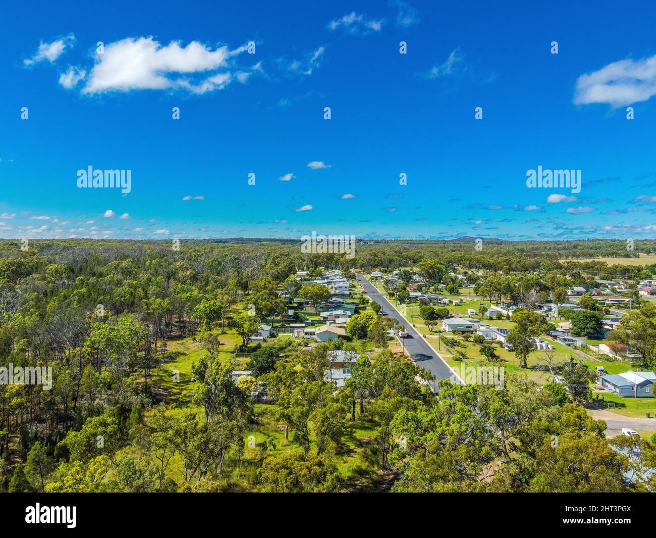 Aerial View of the town of Gilgai surrounded by green rainforests in ...