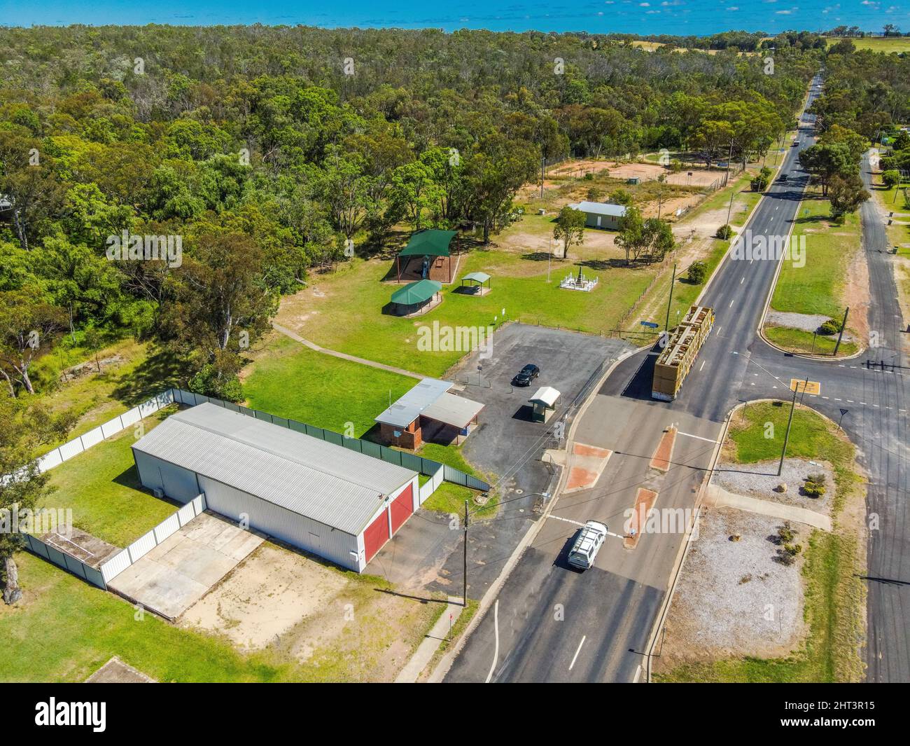 Aerial View of the town of Gilgai surrounded by green rainforests in ...