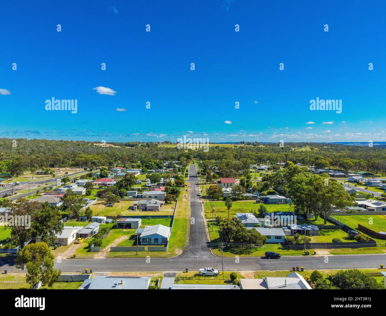 Aerial View of the town of Gilgai surrounded by green rainforests in ...