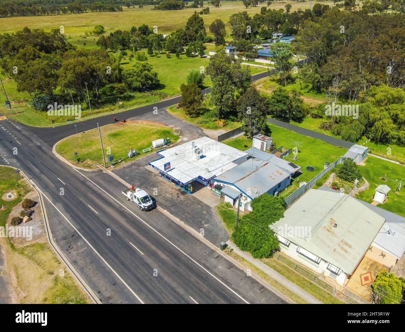 Aerial View of the town of Gilgai surrounded by green rainforests in ...