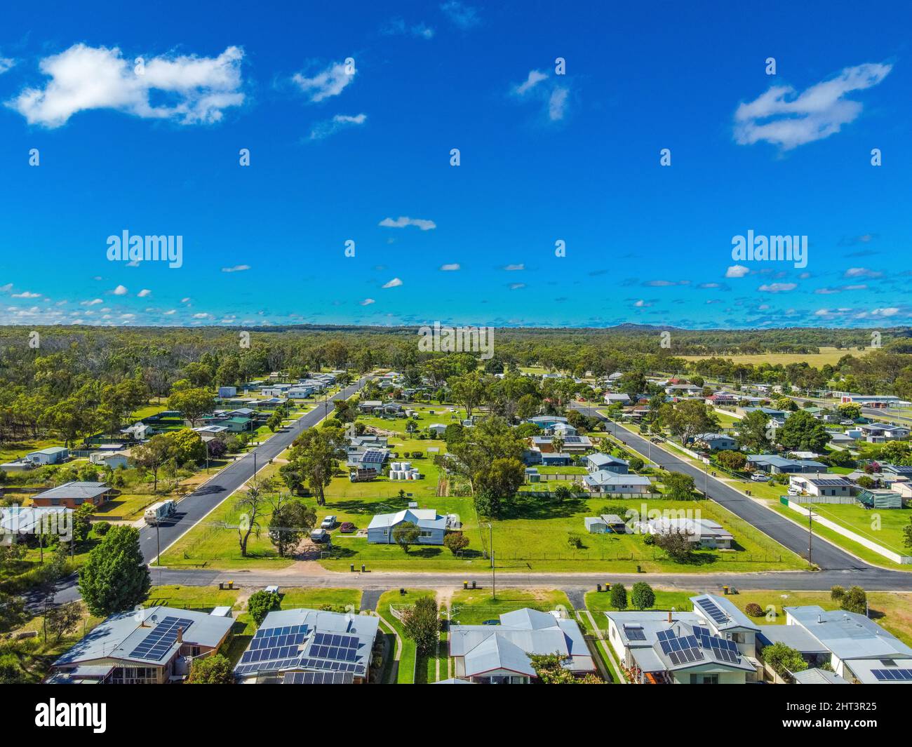 Aerial View of the town of Gilgai surrounded by green rainforests in ...