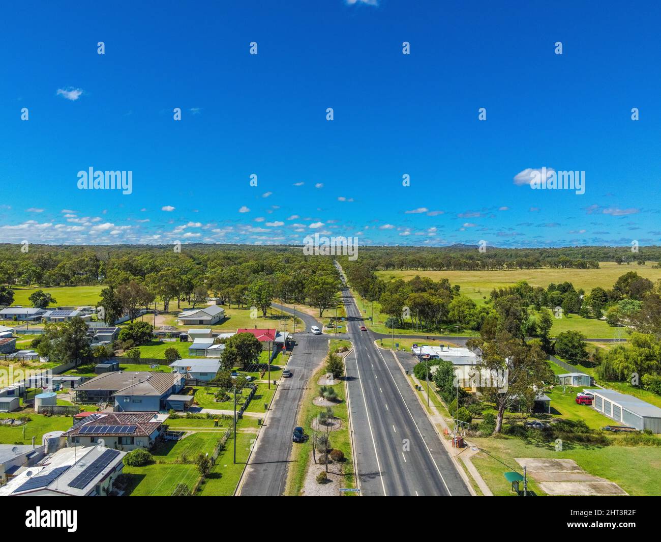 Aerial View of the town of Gilgai surrounded by green rainforests in ...