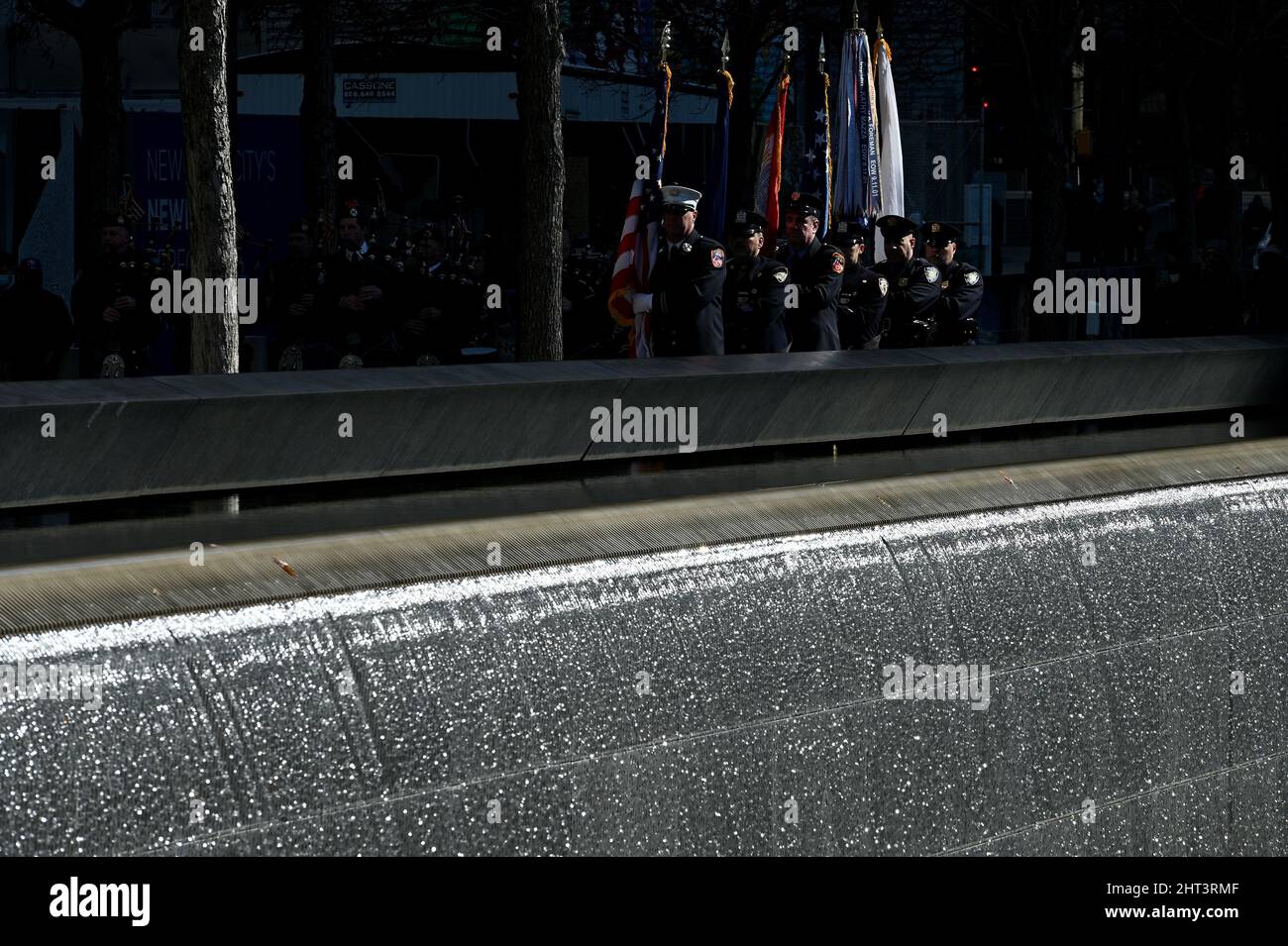 Members of the FDNY Color guard walk along the North Tower Memorial ...
