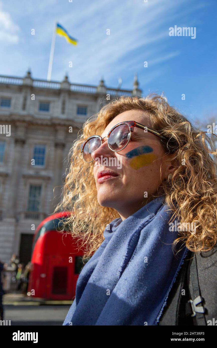 A Protester has her face painted in yellow and blue during a Ukraine ...